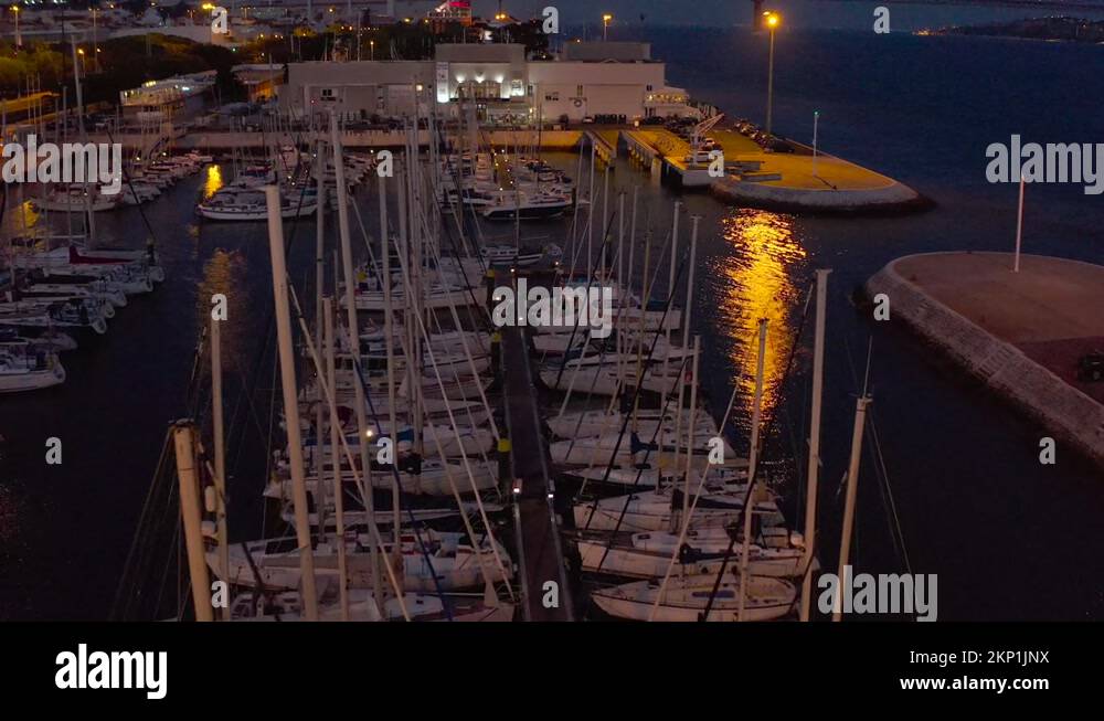 Yacht marina by night, Flyover through sailing boat masts, Nautical ...