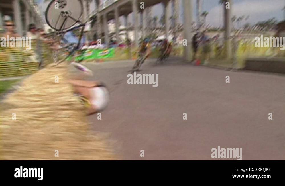 Triathlon cyclists crash in tight turn Stock Video Footage - Alamy