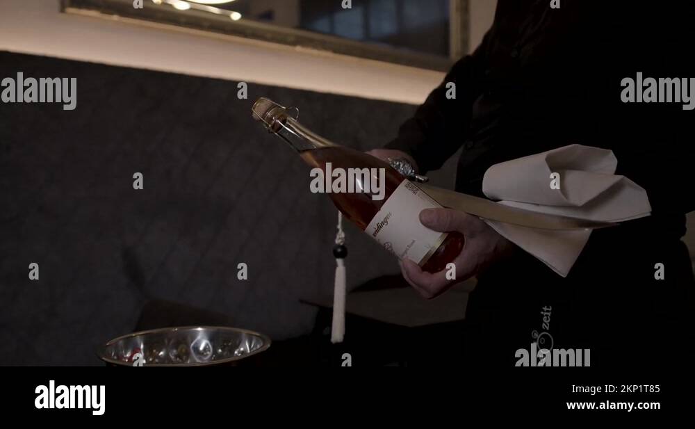 Barkeeper opening Champagne with a sword Stock Video Footage - Alamy