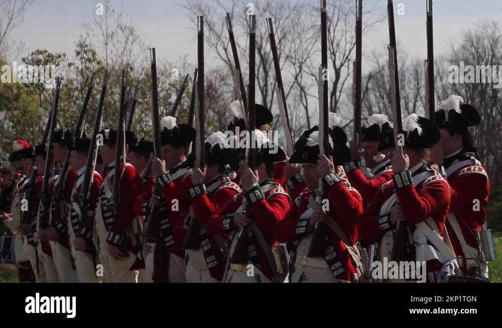 British Redcoat Re-enactor Soldiers armed with flintlock muskets, March ...