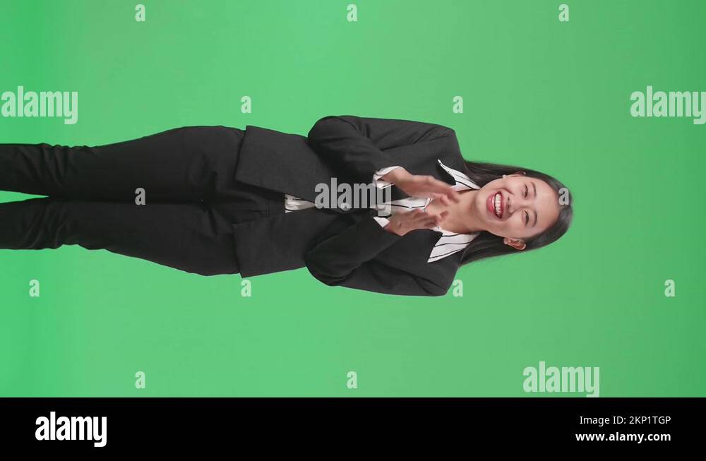 An Asian Business Woman Clapping Her Hands In The Green Screen Studio ...