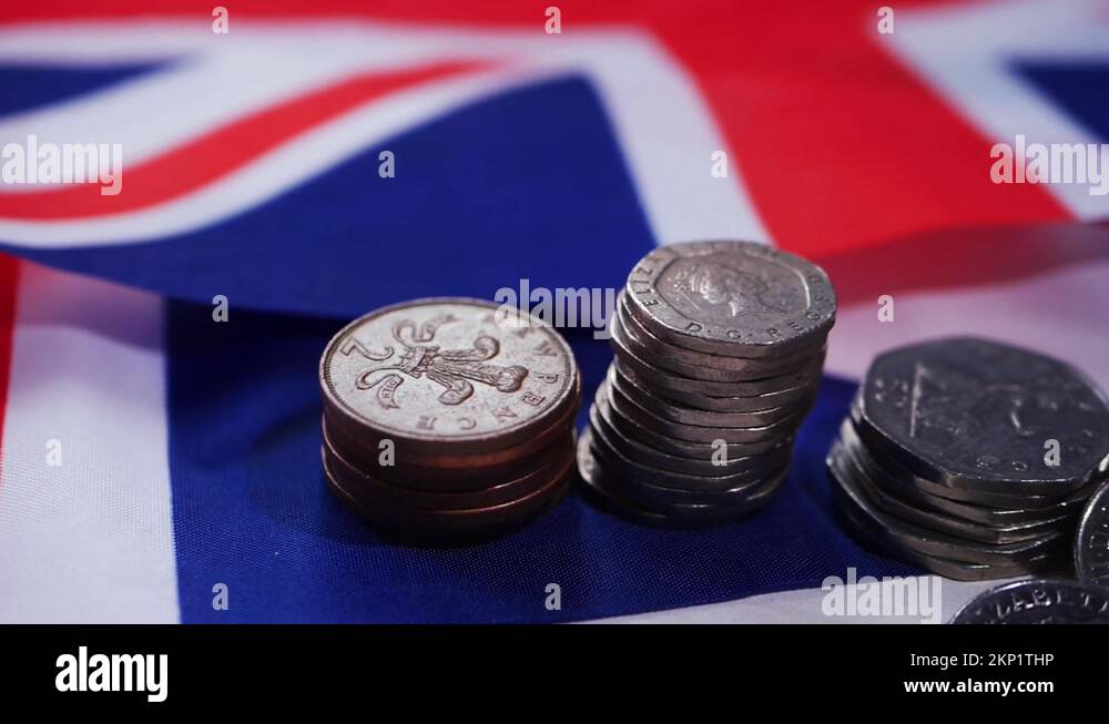 Loose change British money in coins with Union Jack flag Stock Video ...