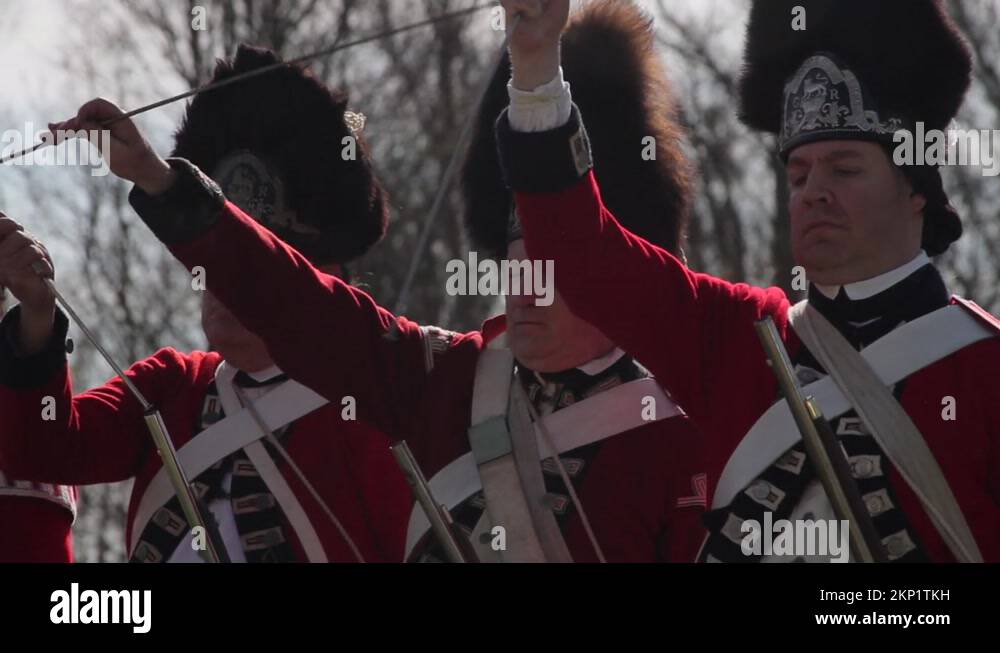British Redcoat Re-enactor Soldiers armed with flintlock muskets, Load ...