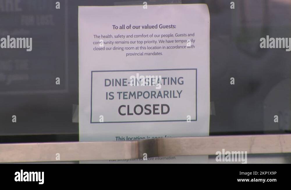 Restaurant window displays sign for dine-in seating closure during ...