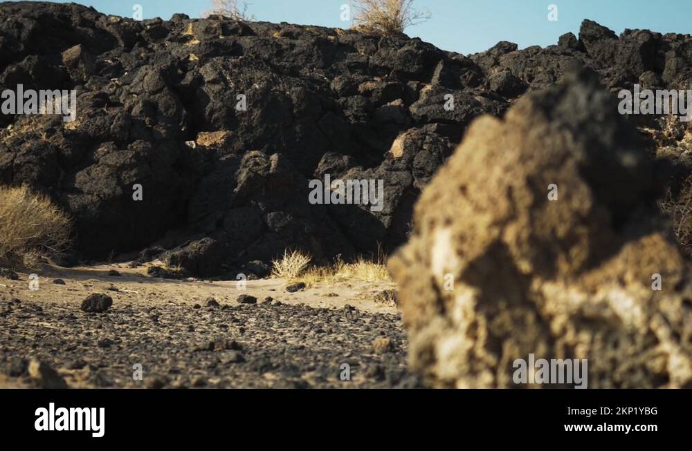 Volcanic rocks in the Mojave desert landscape Stock Video Footage - Alamy
