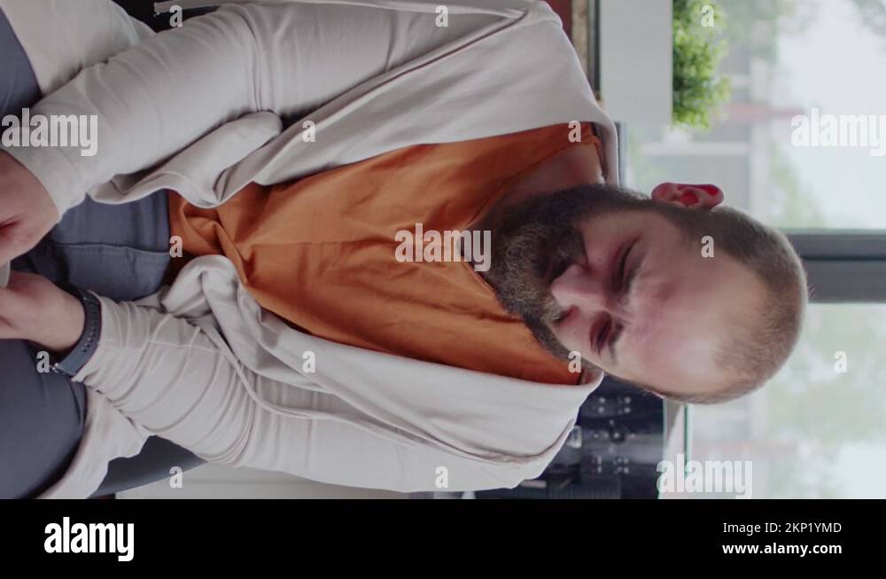 Vertical video: Close up of sad man crying and sharing story about ...