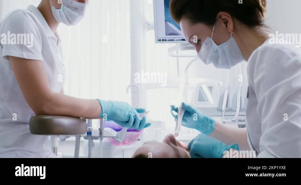 Dental examination of the patient's teeth using a camera Stock Video ...