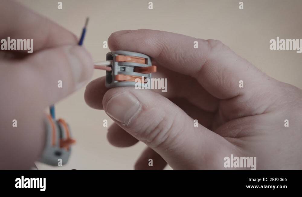 An electrician installs wiring using special connectors Stock Video ...