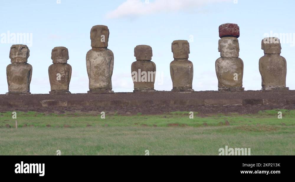 Ancient moai stand looking west, worshipping the sun god Kon Tiki on ...
