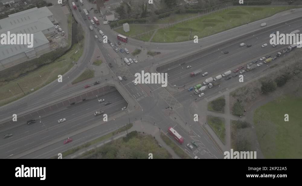 Heavy traffic on highway and multilevel intersection in town outskirts ...