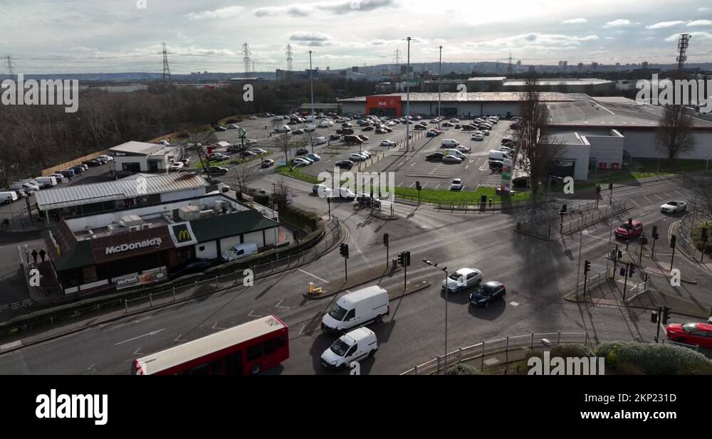 Cars passing road intersection at shopping centre Stock Video Footage ...