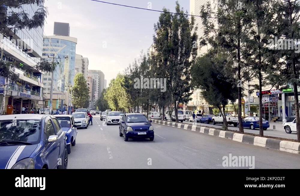 tree lined streets with traffic in addis ababa skyline in ethiopia ...