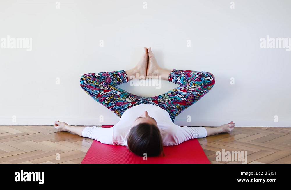 Butterfly, Badda Konasana inverted posture with wall Stock Video ...