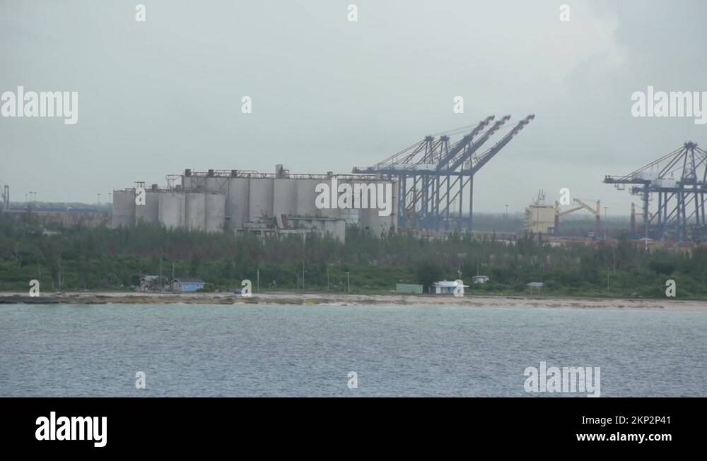 A huge warehouse and shipping container yard in small island in middle ...