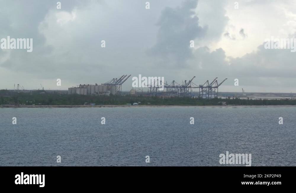 A wide angle of an island with Cargo shipping container yard and huge ...