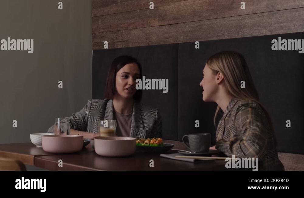 Two girlfriends have lunch in a Japanese cafe Stock Video Footage - Alamy