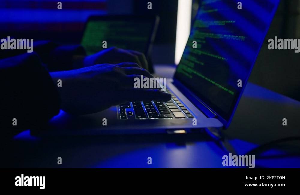 Anonymous Hacker With Laptop Typing The Keyboard Cyber Attack Concept