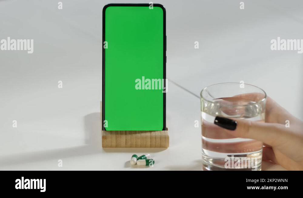 Handheld Camera: Back View of Brunette woman Holding Chroma Key Green ...