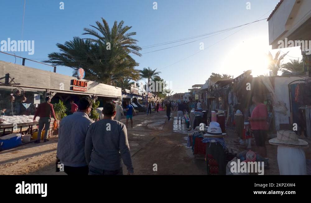 Establishing shot Street market, people walking around Dahab area ...