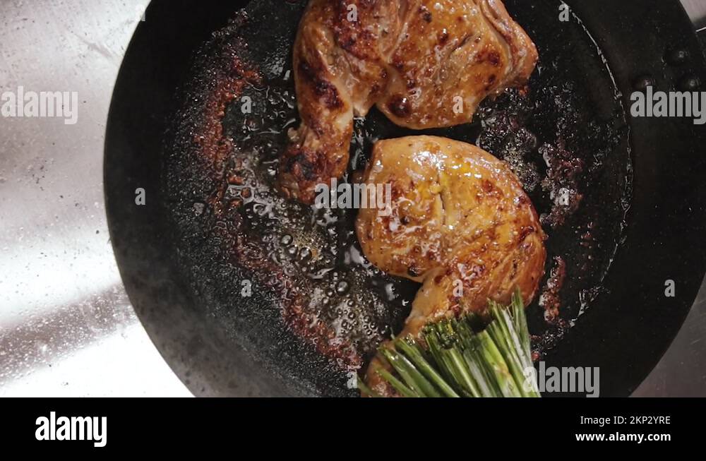 Oil Dabbing Chicken Thighs With Lemongrass While Cooking In A Pan. top ...