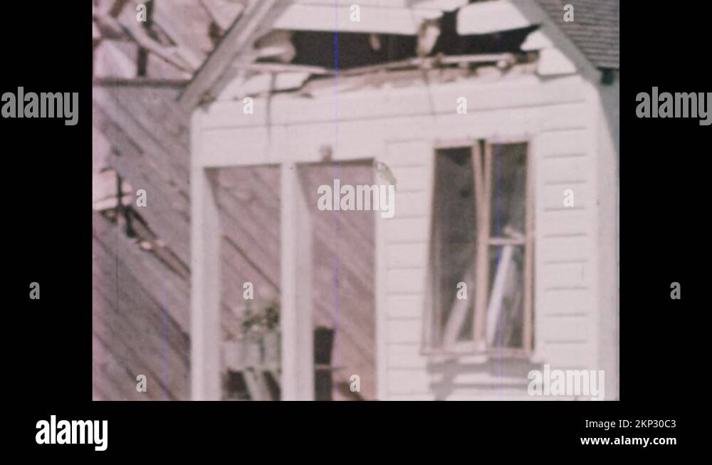 1940s: Damaged houses with holes and exploded windows. Industrial area ...