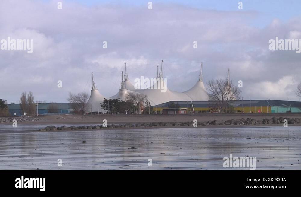 Butlins Holiday Camp seen across the seashore at low tide.. Minehead ...