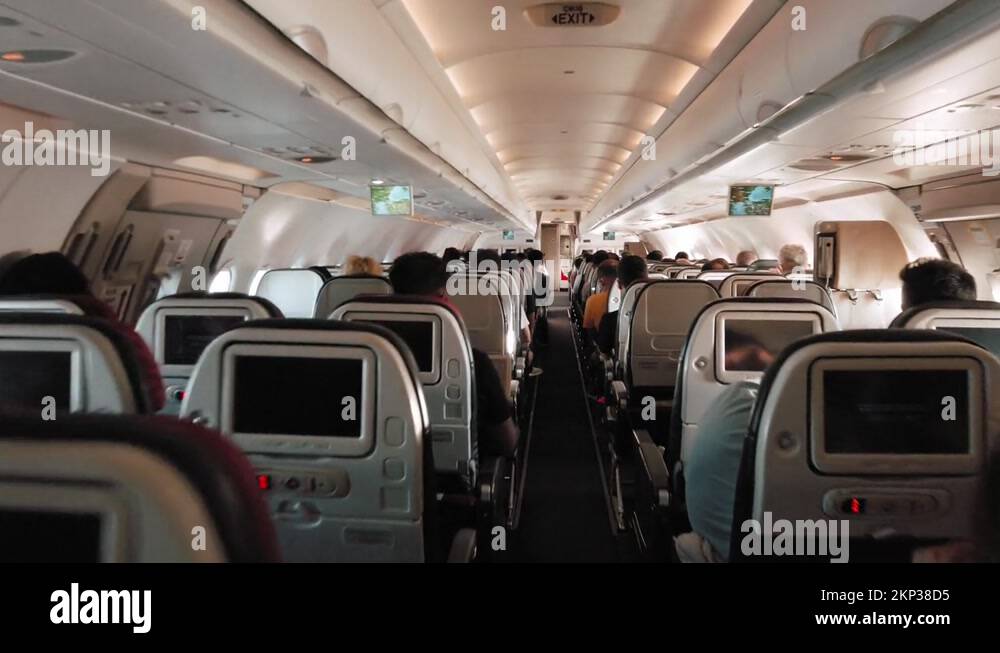 People inside passenger aircraft hallway before departure, flight 4K ...