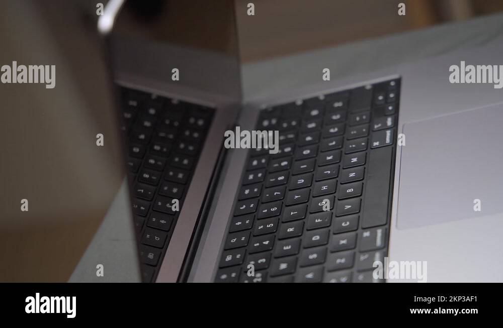 Cinematic footage of an Apple M1 MacBook Pro 14 inch with an overhead ...