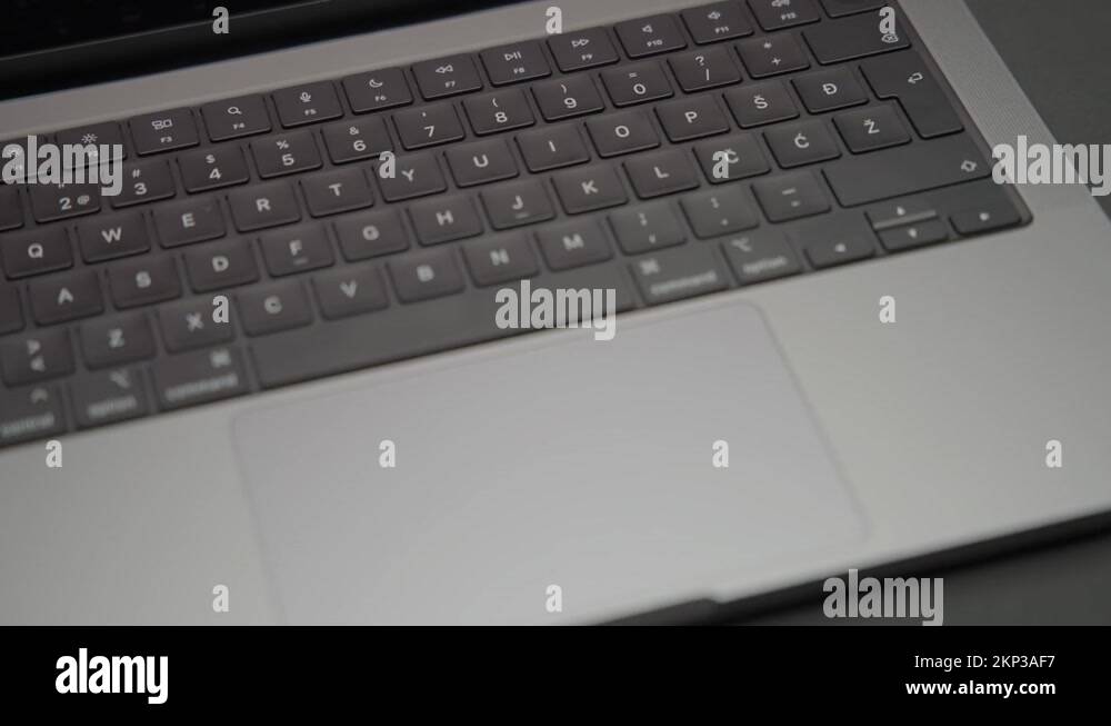 Cinematic footage of an Apple M1 MacBook Pro 14 inch with an overhead ...