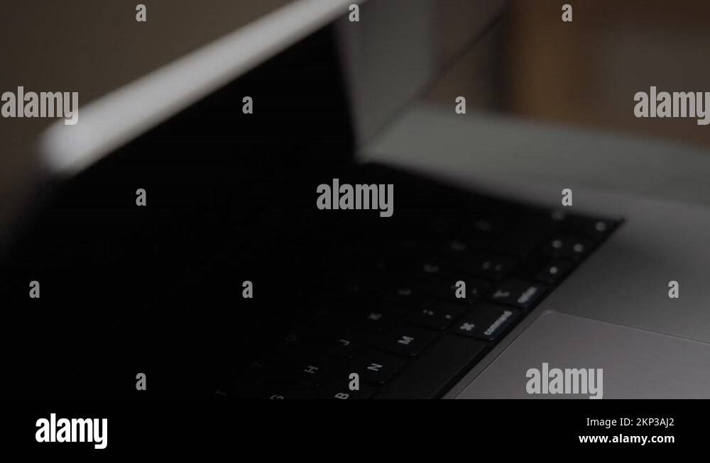 Cinematic footage of an Apple M1 MacBook Pro 14 inch with an overhead ...