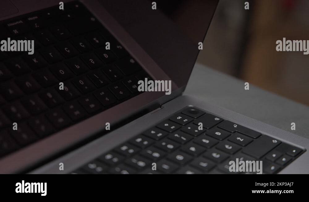 Cinematic footage of an Apple M1 MacBook Pro 14 inch with an overhead ...