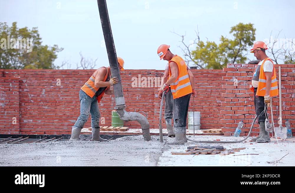 Reinforced concrete. Workers make a reinforced concrete structure ...