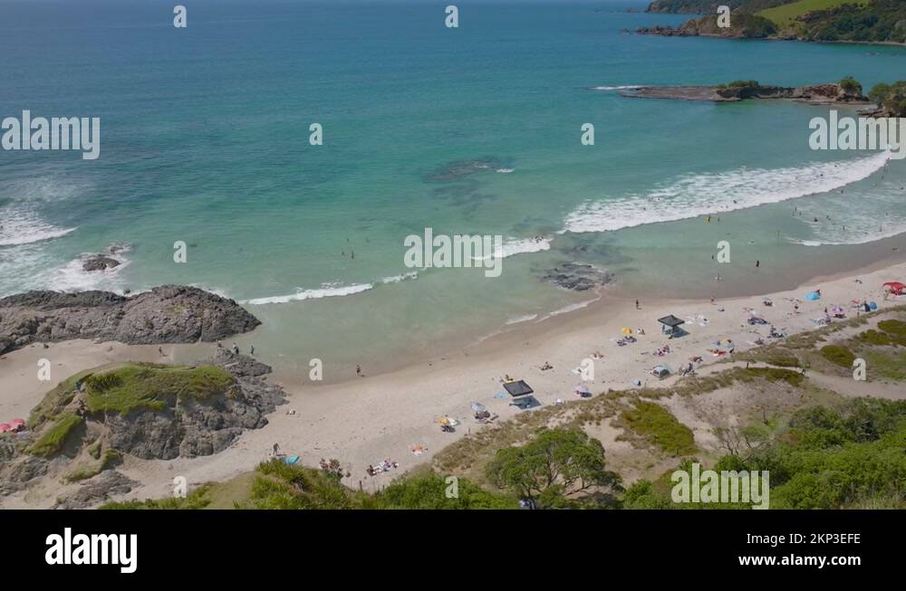Swimmers Enjoying The Sun And Surf, Tawharanui beach, New Zealand Stock ...