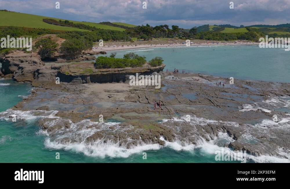 Swimmers Enjoying The Sun And Surf, Tawharanui beach, New Zealand Stock ...