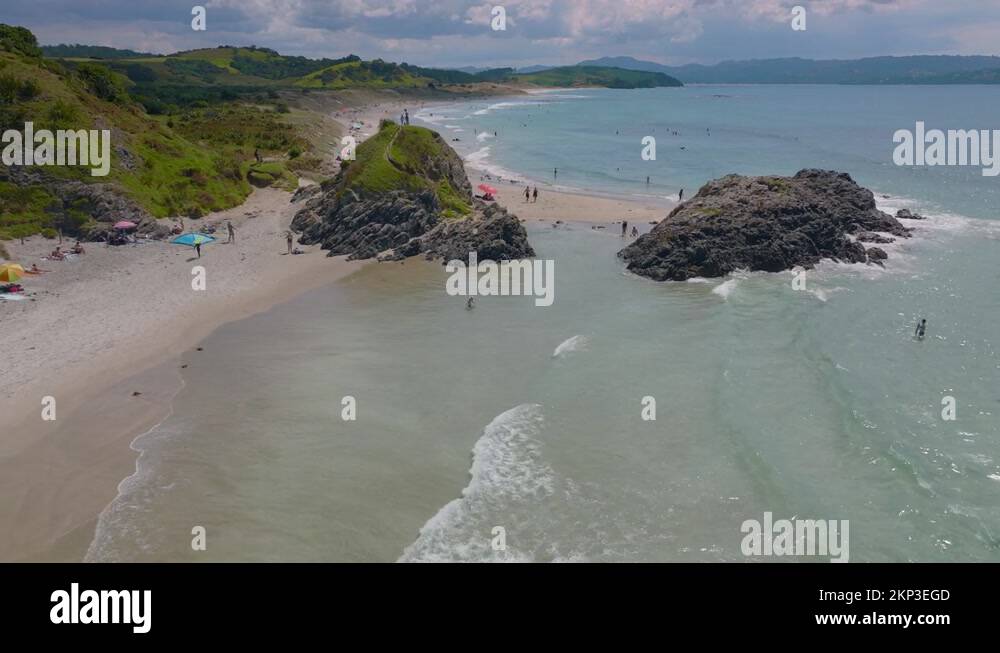 Swimmers Enjoying The Sun And Surf, Tawharanui beach, New Zealand Stock ...