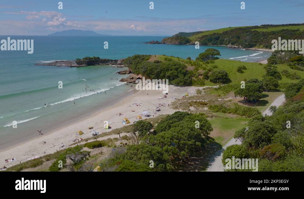 Swimmers Enjoying The Sun And Surf, Tawharanui beach, New Zealand Stock ...