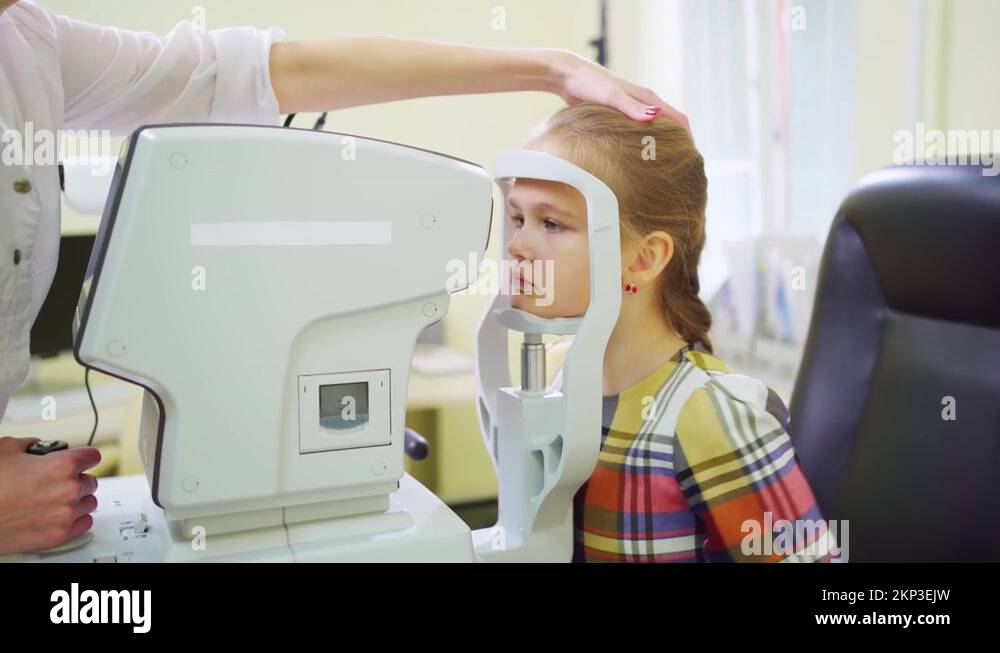 examination of kid with slit lamp. equipping ophthalmologist, an optics ...