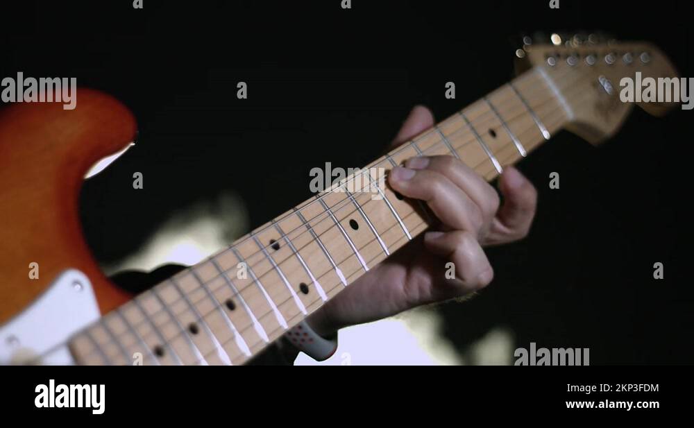 A Rock Guitarist Playing His Iconic Electric Guitar On Stage Stock ...