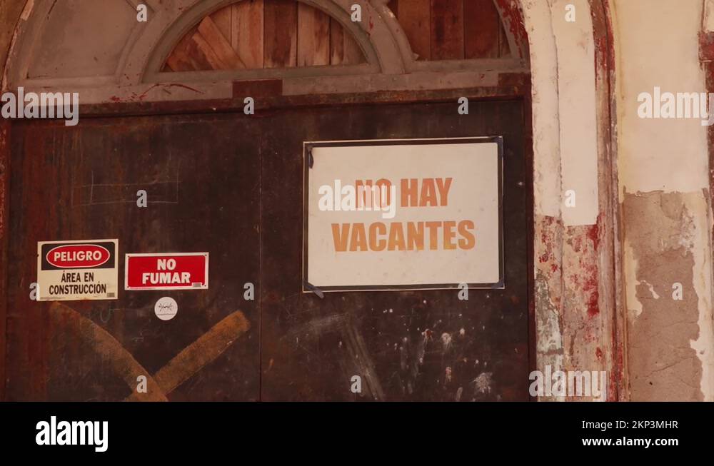 Not hiring sign taped to an old big entrance door to a historic ...