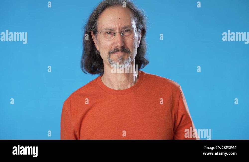 Excited happy fun mature man 50s 60s wears orange shirt showing thumbs ...