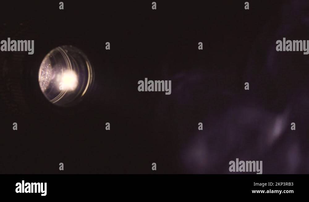 Cine camera projector light beam with smoke fog in dark room. Motion ...