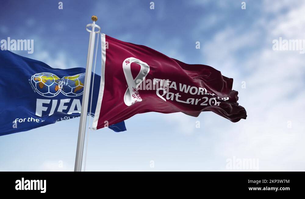 Flags with FIFA and Qatar 2022 World Cup logo waving in the wind Stock ...