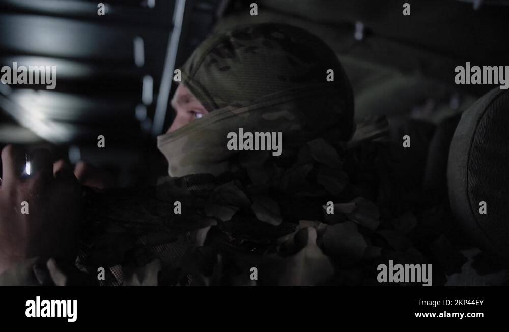 Sniper in an armored military vehicle, puts on a ghillie suit Stock ...