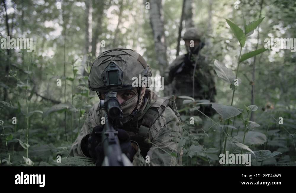 Action shot, special forces soldiers with rifles in their hands, in ...
