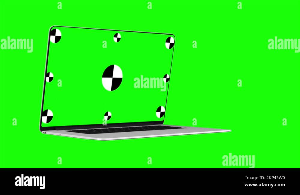 Gray laptop on a green background. Green screen with marks for tracking ...