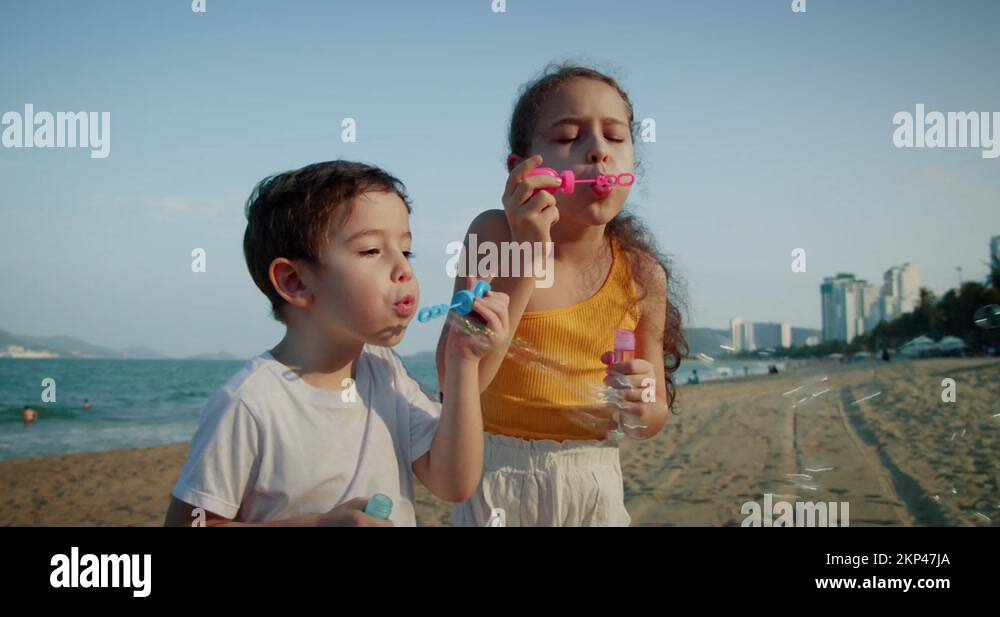 Happy Children playing with soap bubbles.Kids happy smile blow bubbles ...