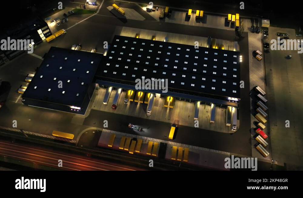Aerial of a logistics park with a loading hub. Semi-trailers trucks ...