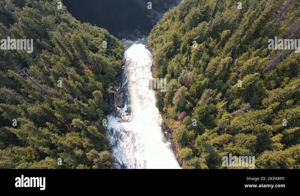 Helmcken Falls powerfully flowing over a cliff on the Murtle River in ...