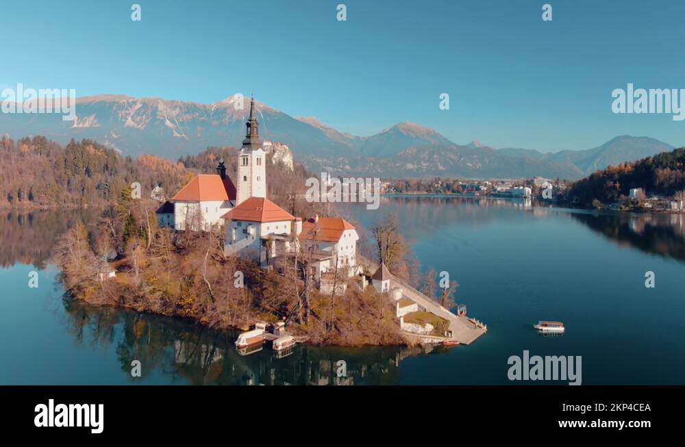Aerial drone of Lake Bled and church on small island, Slovenia, during ...