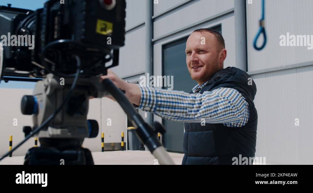 Behind the scene. Actor in front of the camera on the film set outdoor ...